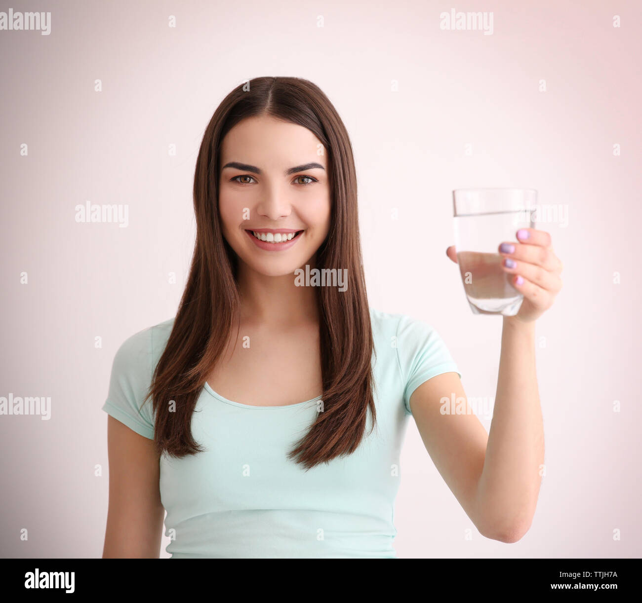 Beautiful girl drinking water Stock Photo - Alamy