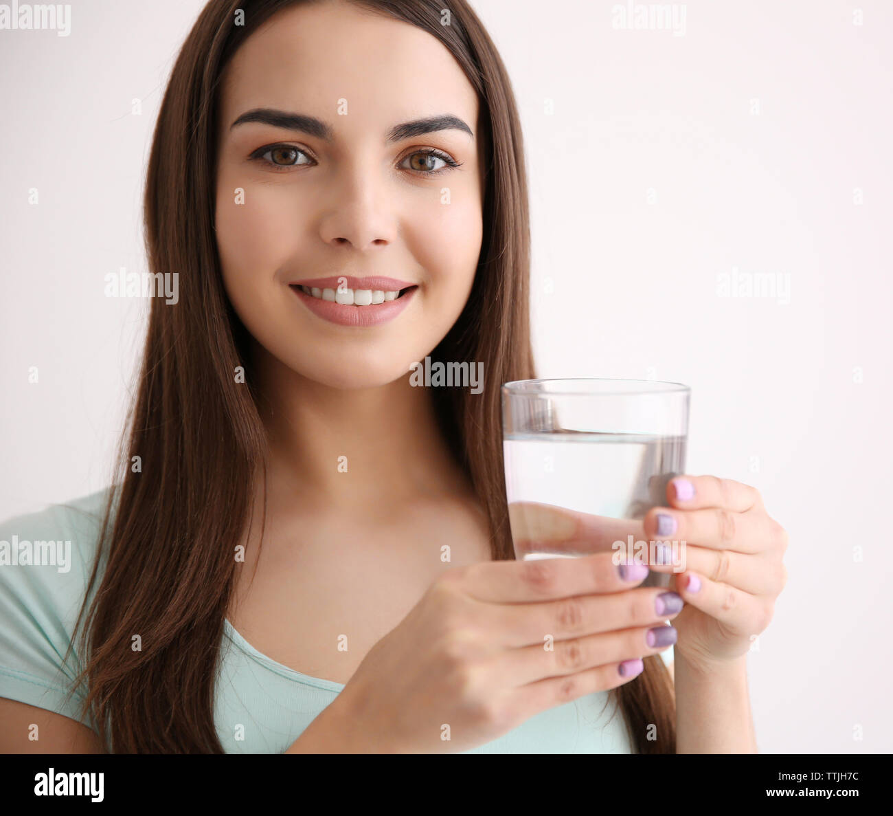 Beautiful girl drinking water Stock Photo - Alamy