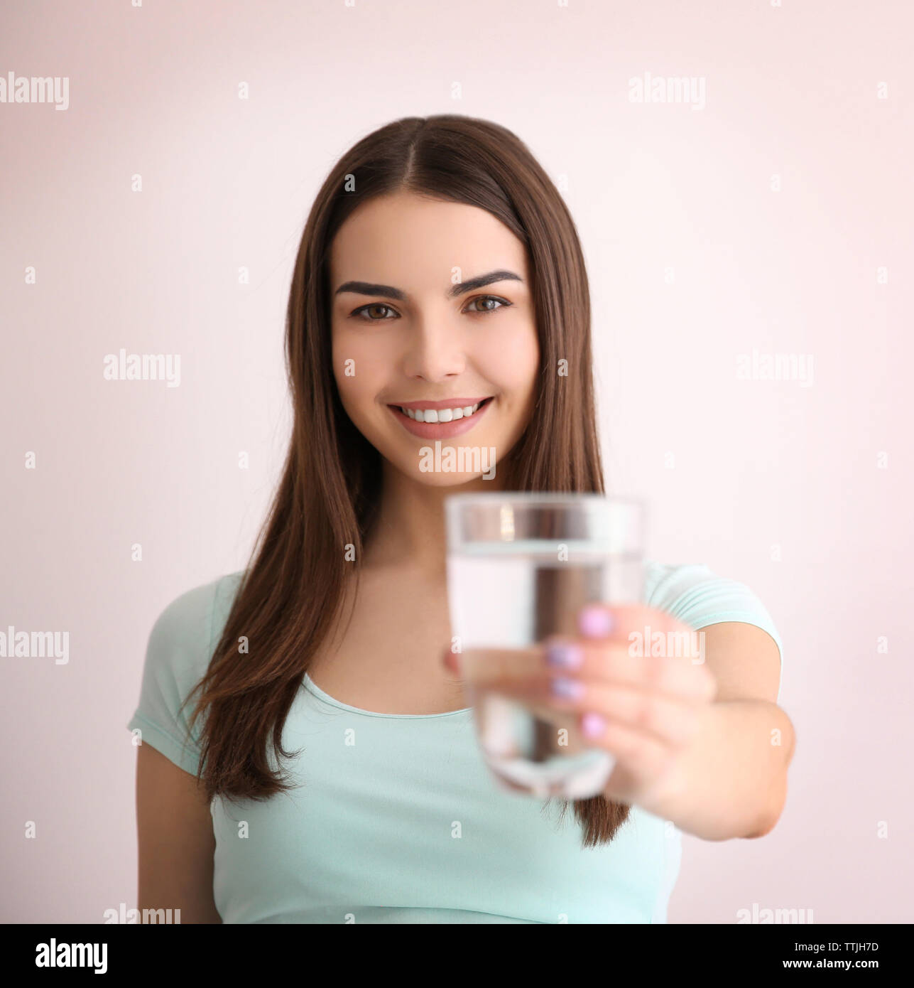 Beautiful girl drinking water Stock Photo - Alamy