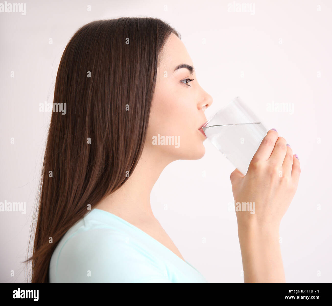 Beautiful girl drinking water Stock Photo - Alamy