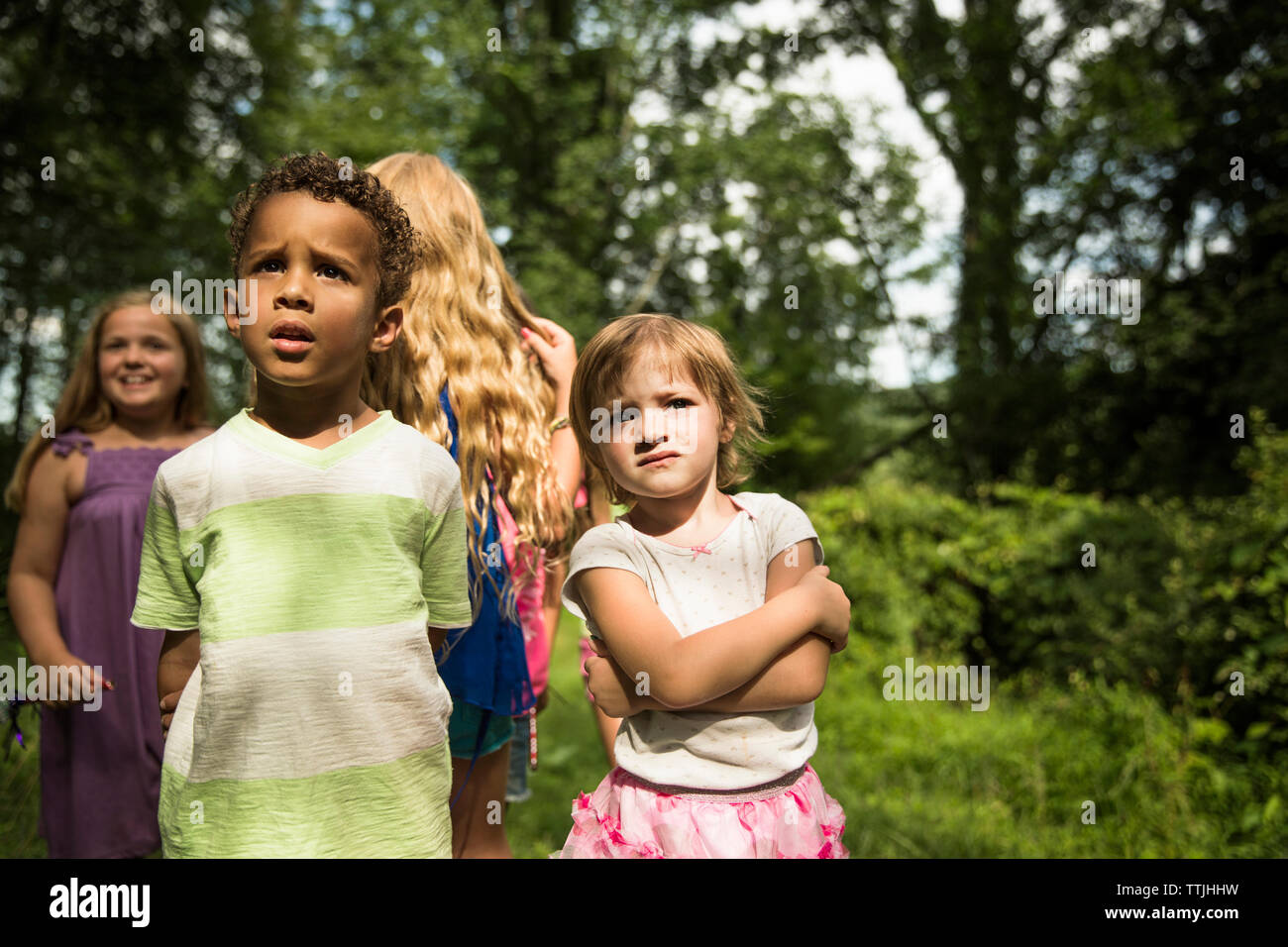 Kids standing smiling hi-res stock photography and images - Alamy