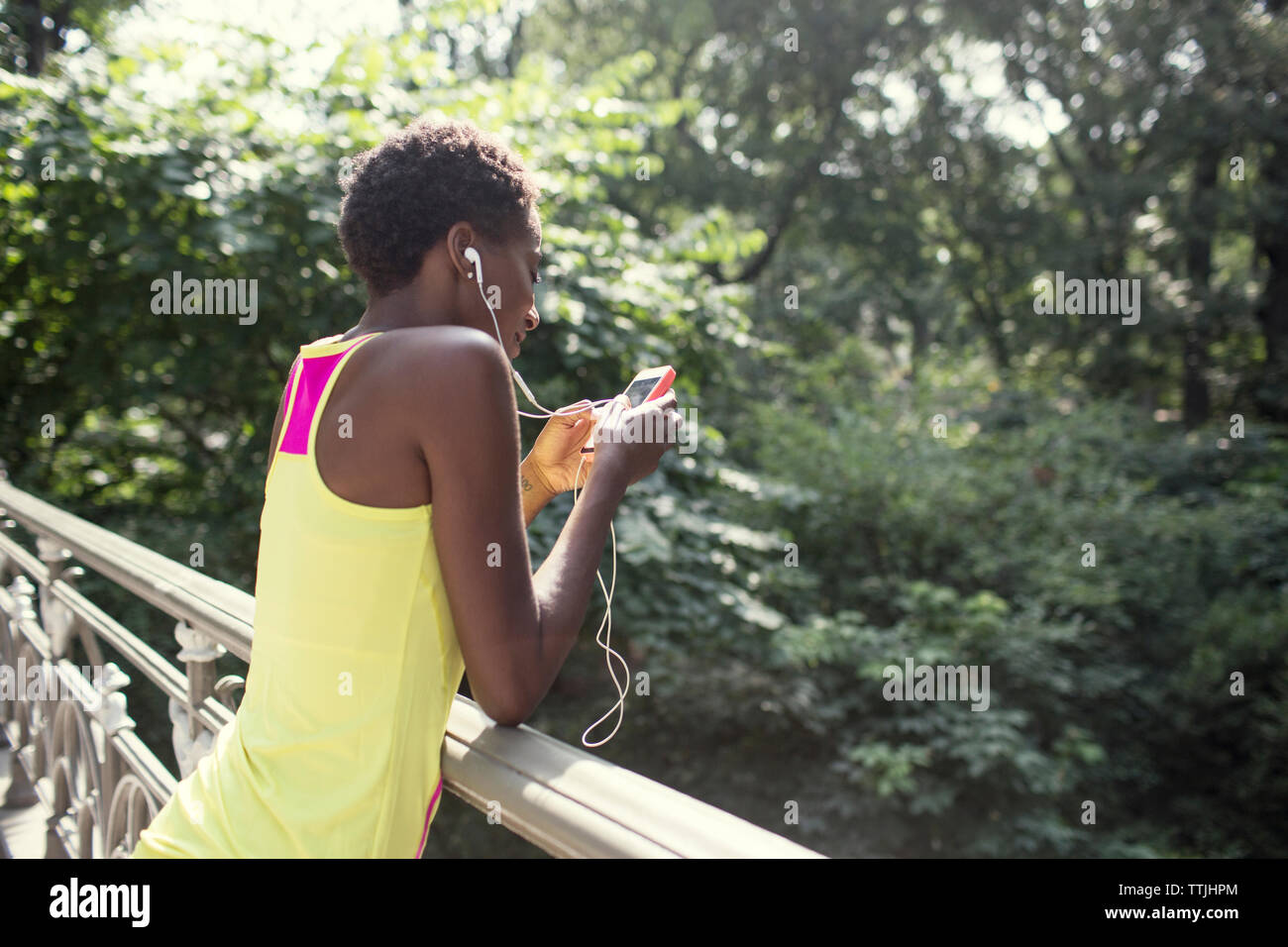 Leaning railing park hi-res stock photography and images - Alamy