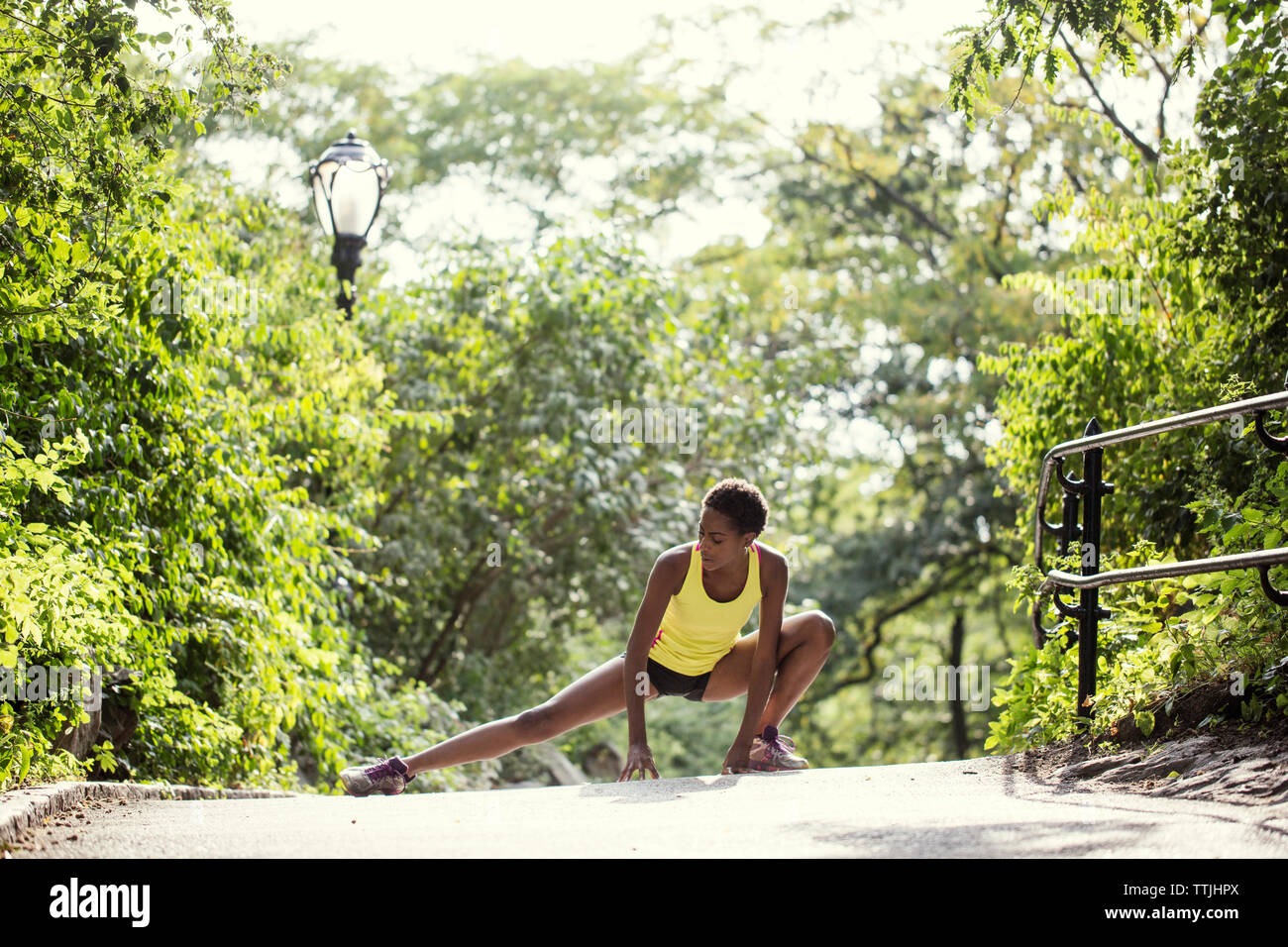 Woman exercising in park morning hi-res stock photography and images ...