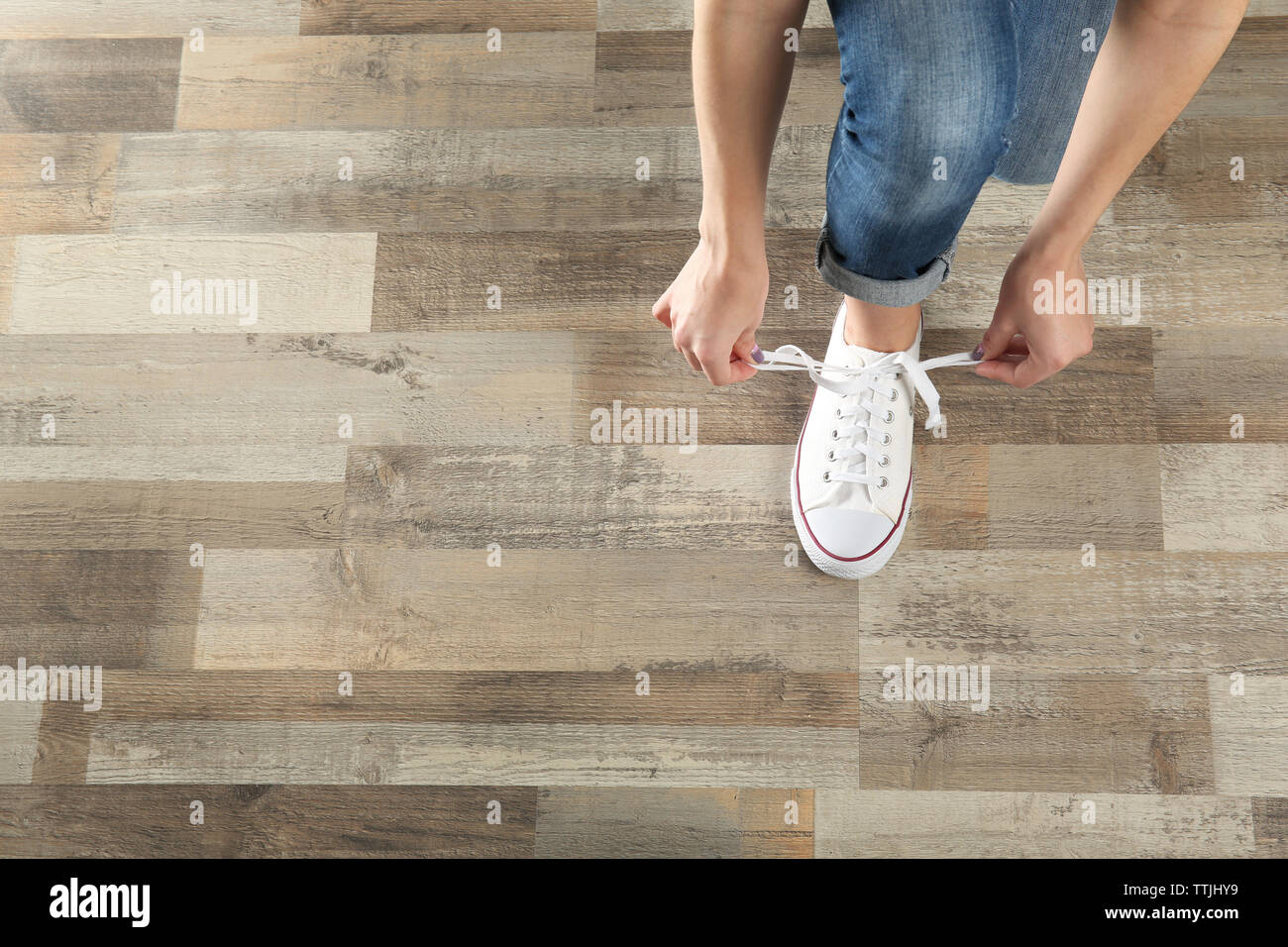 Woman hands tying sport shoes Stock Photo - Alamy