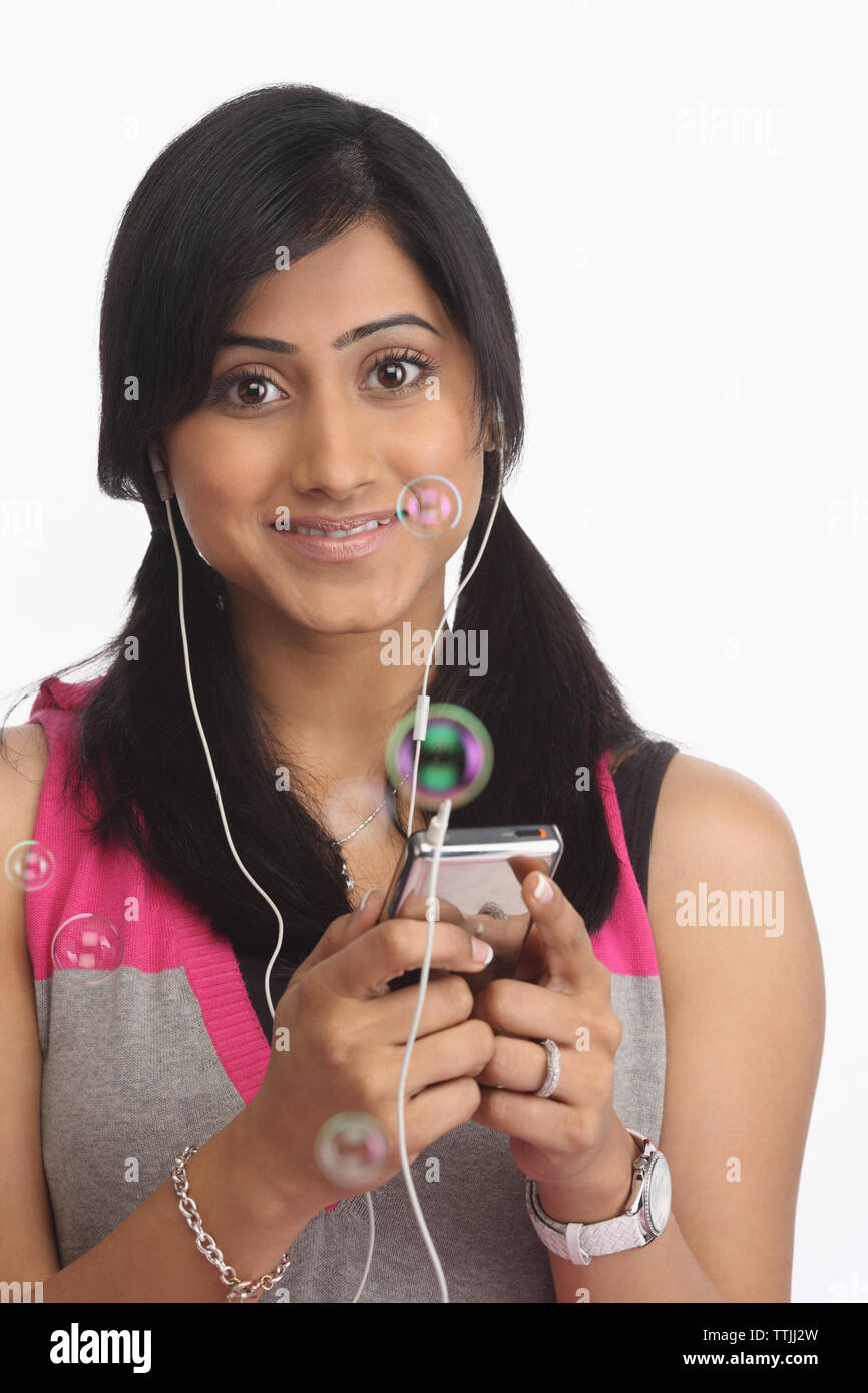Woman listening to Mp3 player Stock Photo - Alamy