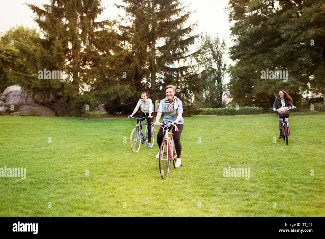 Three friends cycling hi-res stock photography and images - Alamy