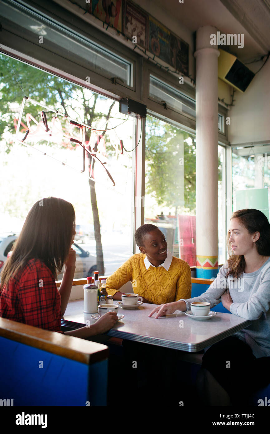 Group of friends talking cafe hi-res stock photography and images - Alamy