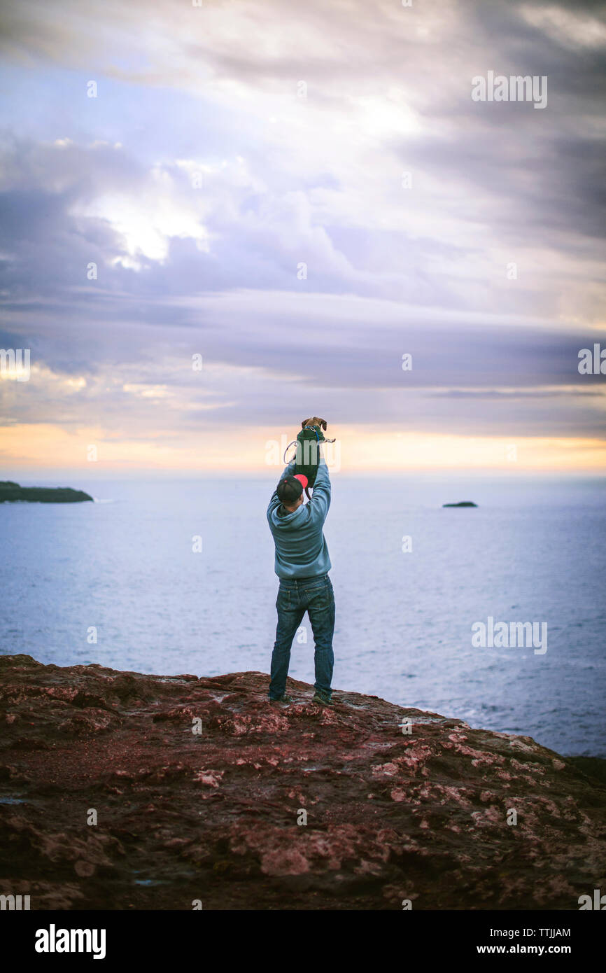 Man carrying dog hi-res stock photography and images - Alamy