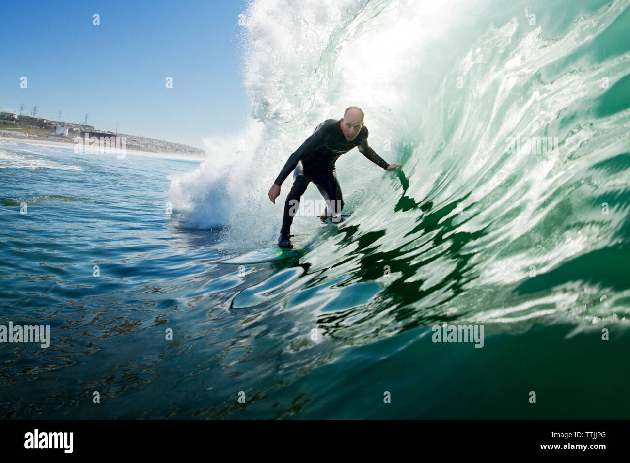 Man surfboarding in sea Stock Photo - Alamy