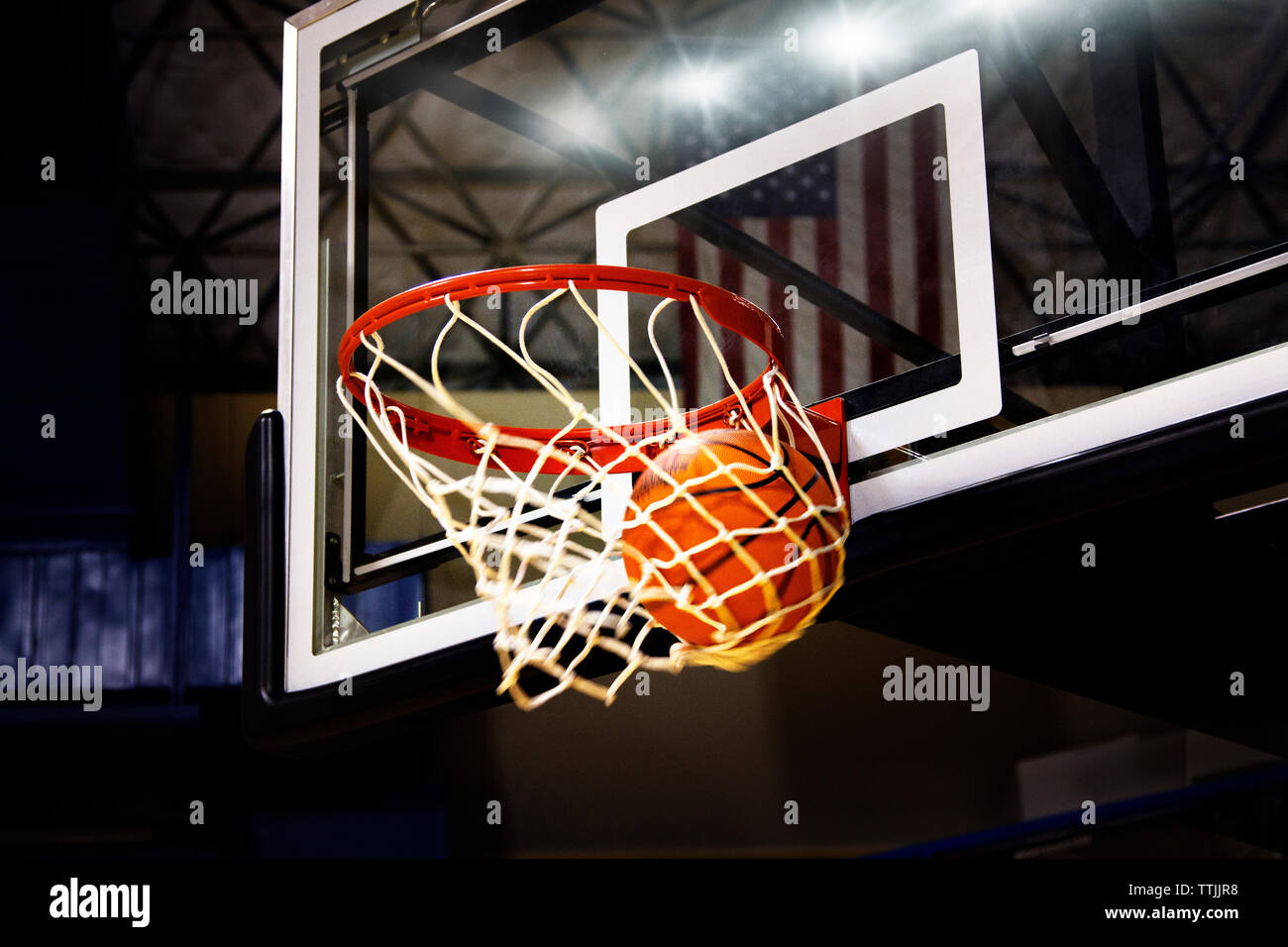 Basketball in hoop Stock Photo - Alamy