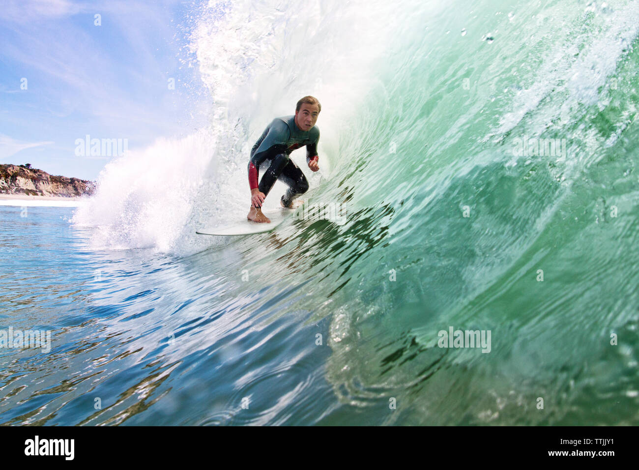 Man surfboarding at beach Stock Photo - Alamy