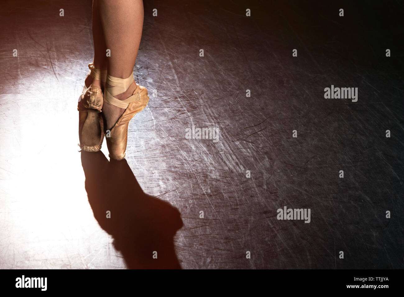 Low section of ballet dancer standing at studio Stock Photo - Alamy