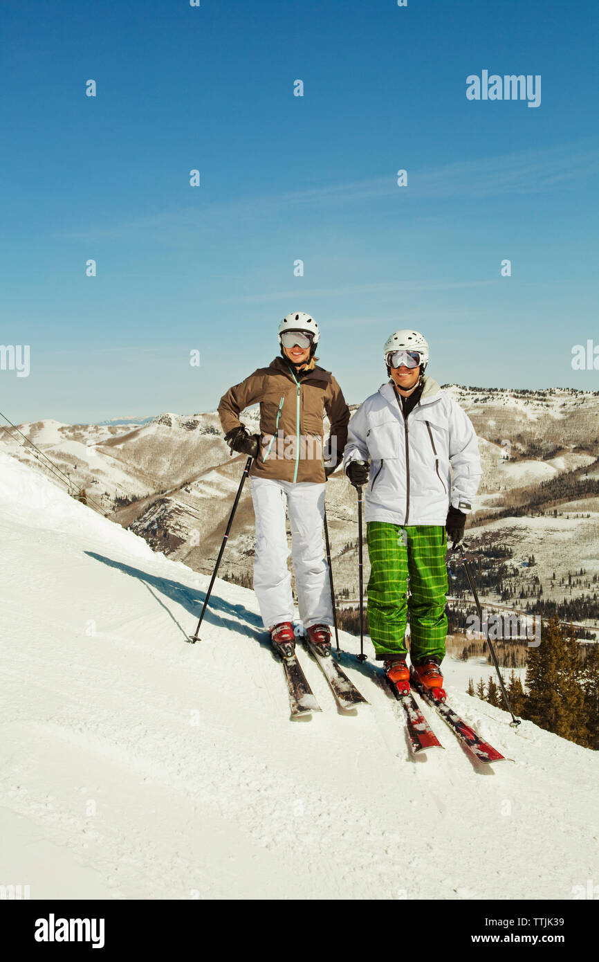 Woman standing skis poles hi-res stock photography and images - Alamy