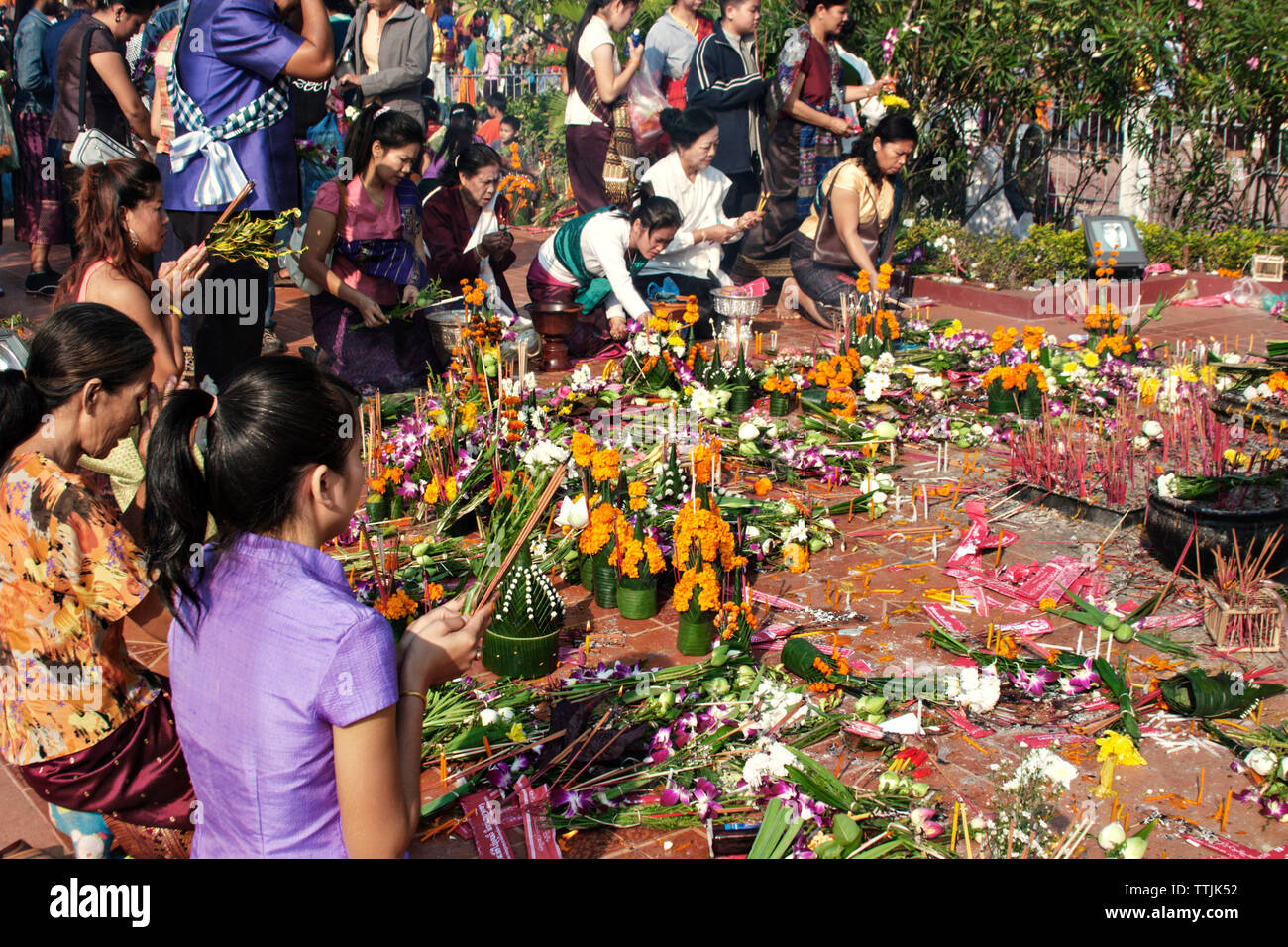 Women giving religious offering at temple Stock Photo - Alamy