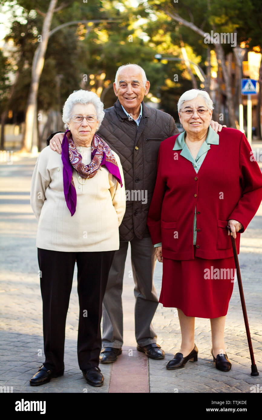 Portrait of senior adults standing on road Stock Photo - Alamy