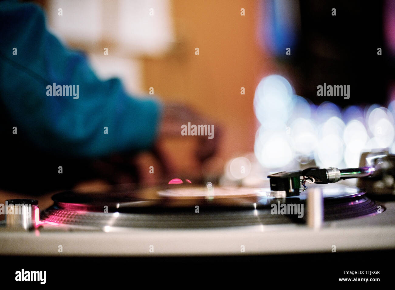 Cropped image of DJ mixing music at record player in nightclub Stock ...