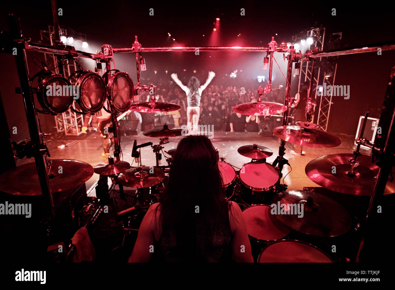 Rock band performing at concert Stock Photo - Alamy