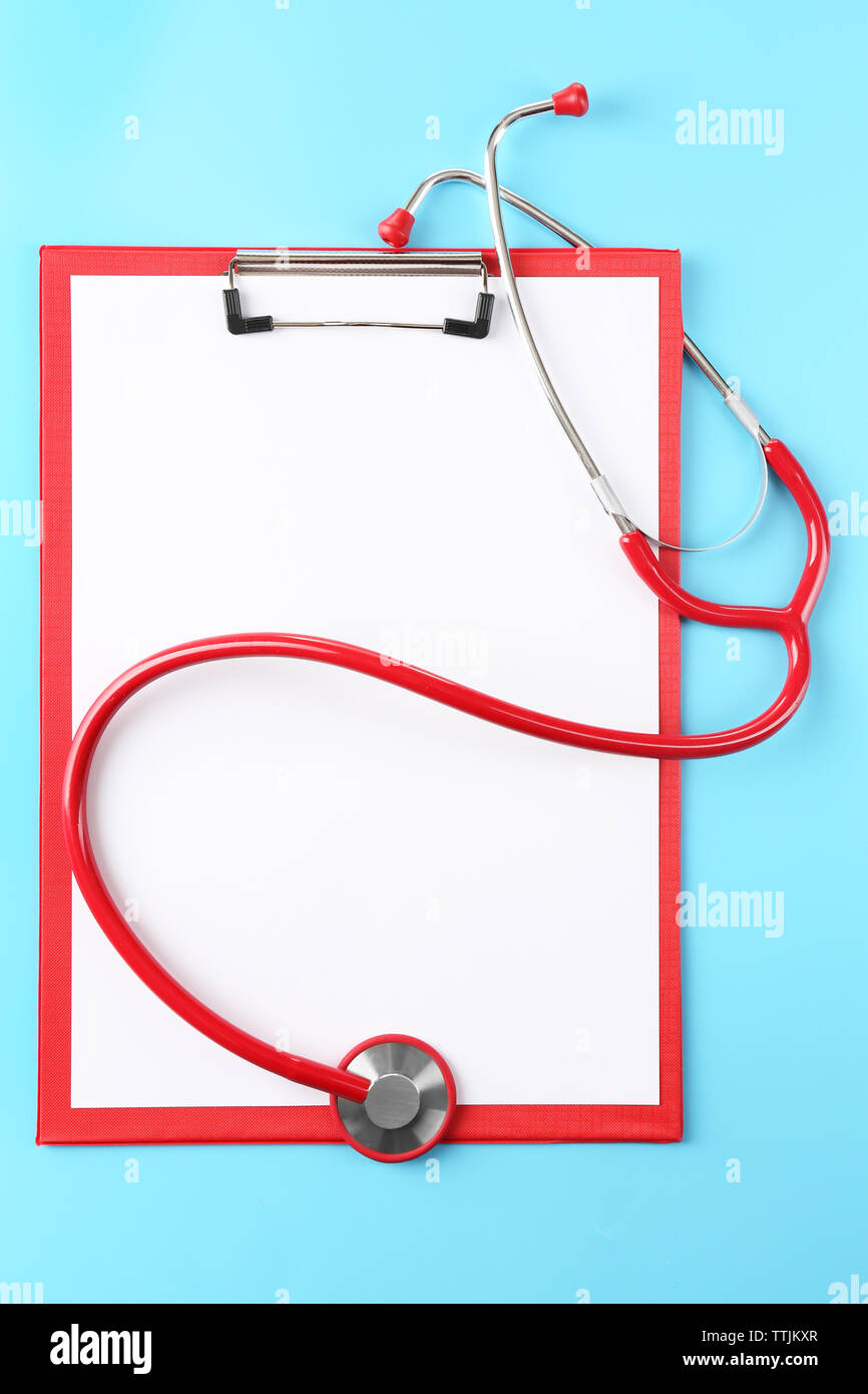 Red stethoscope with prescription on blue background Stock Photo - Alamy