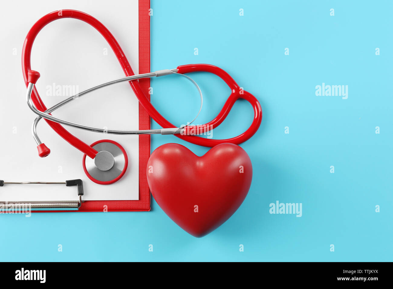 Red stethoscope with prescription on blue background Stock Photo - Alamy