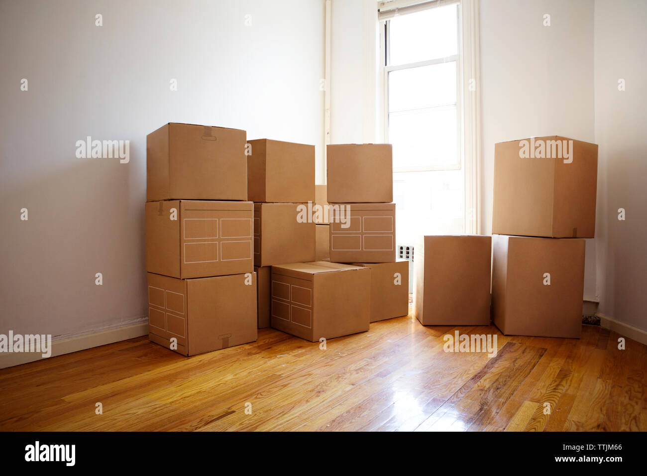 Cardboard boxes in room Stock Photo - Alamy