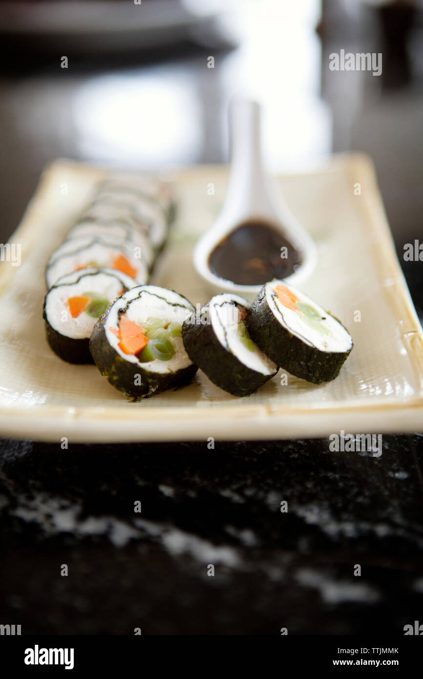 Close-up of sushi rolls in tray on kitchen counter Stock Photo - Alamy