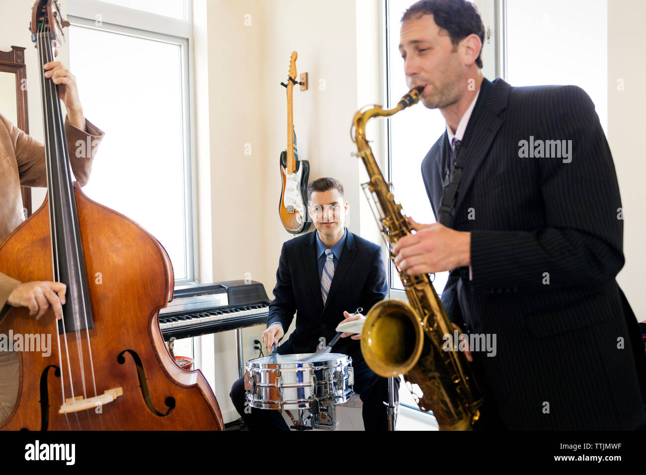 Musicians practicing in studio Stock Photo - Alamy