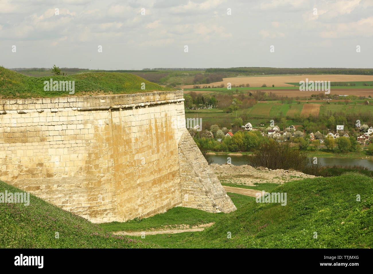 Medieval fortress in village Stock Photo - Alamy