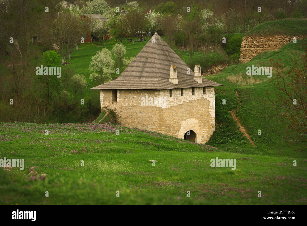 Medieval fortress in village Stock Photo - Alamy
