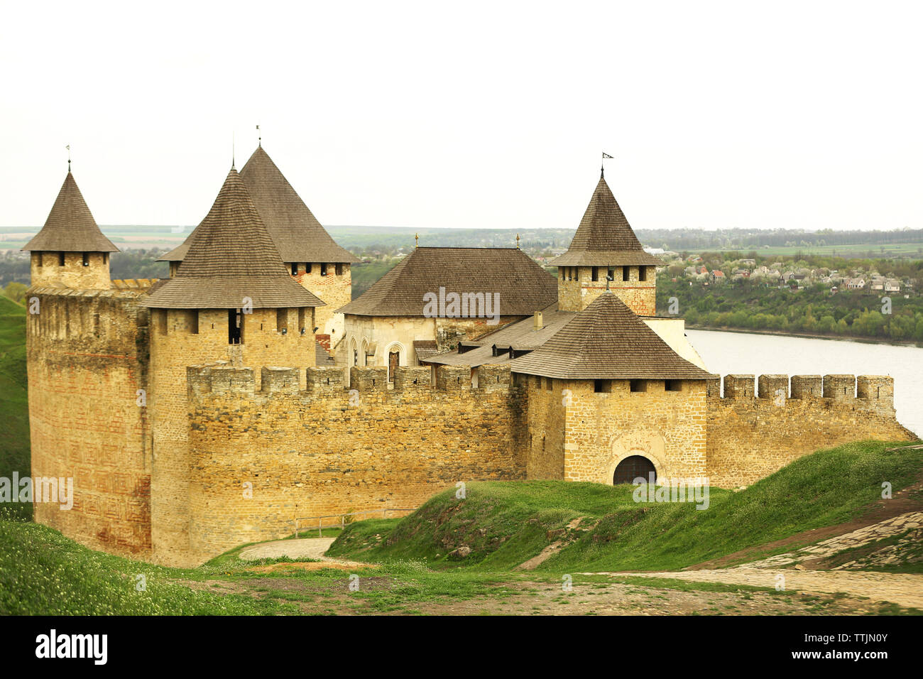 Medieval fortress in village Stock Photo - Alamy