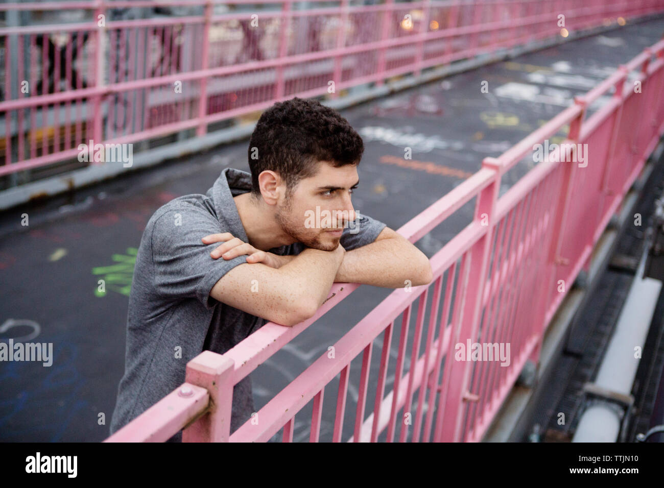 Man leaning on railing hi-res stock photography and images - Alamy