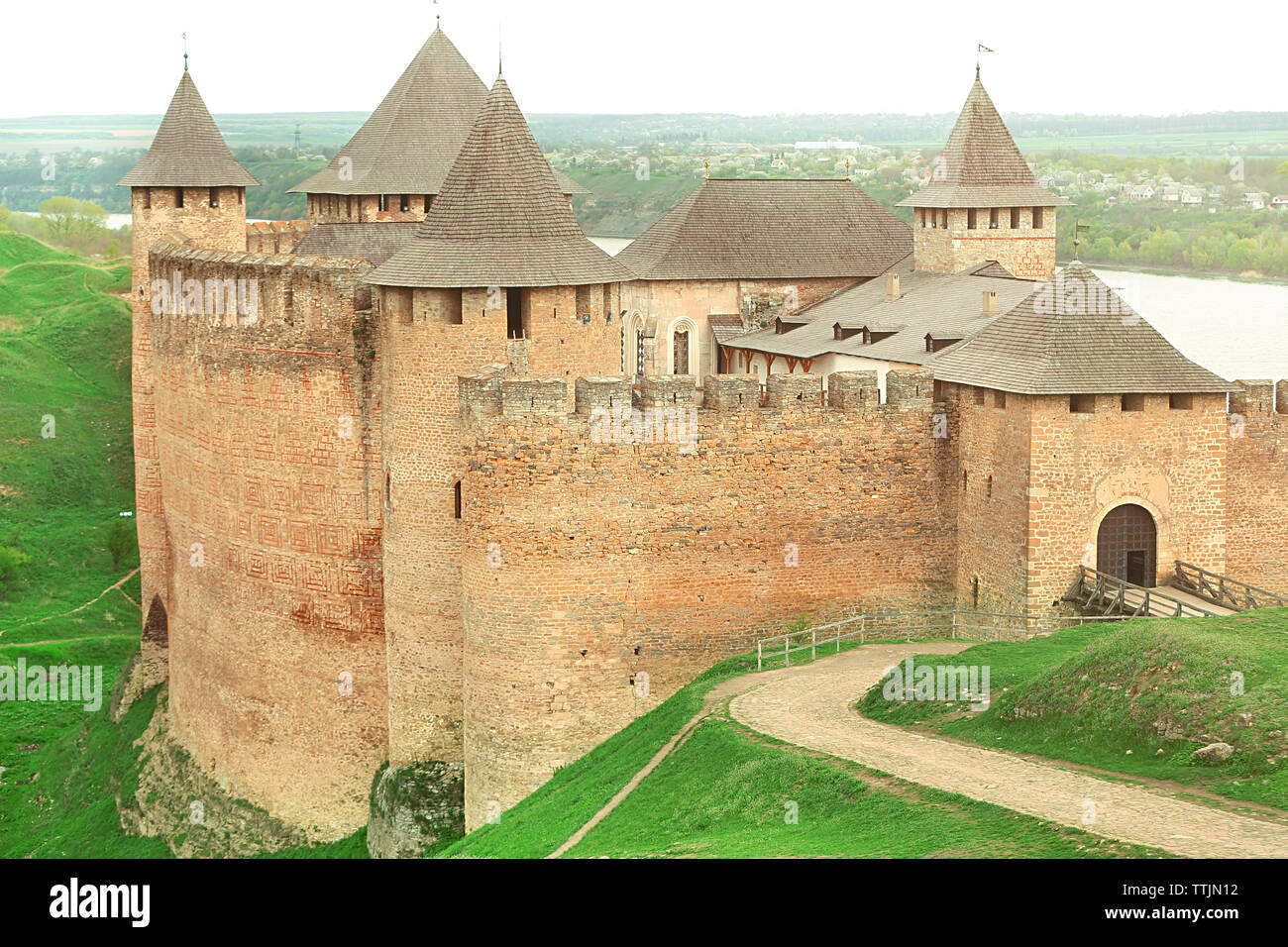 Medieval fortress in village Stock Photo - Alamy