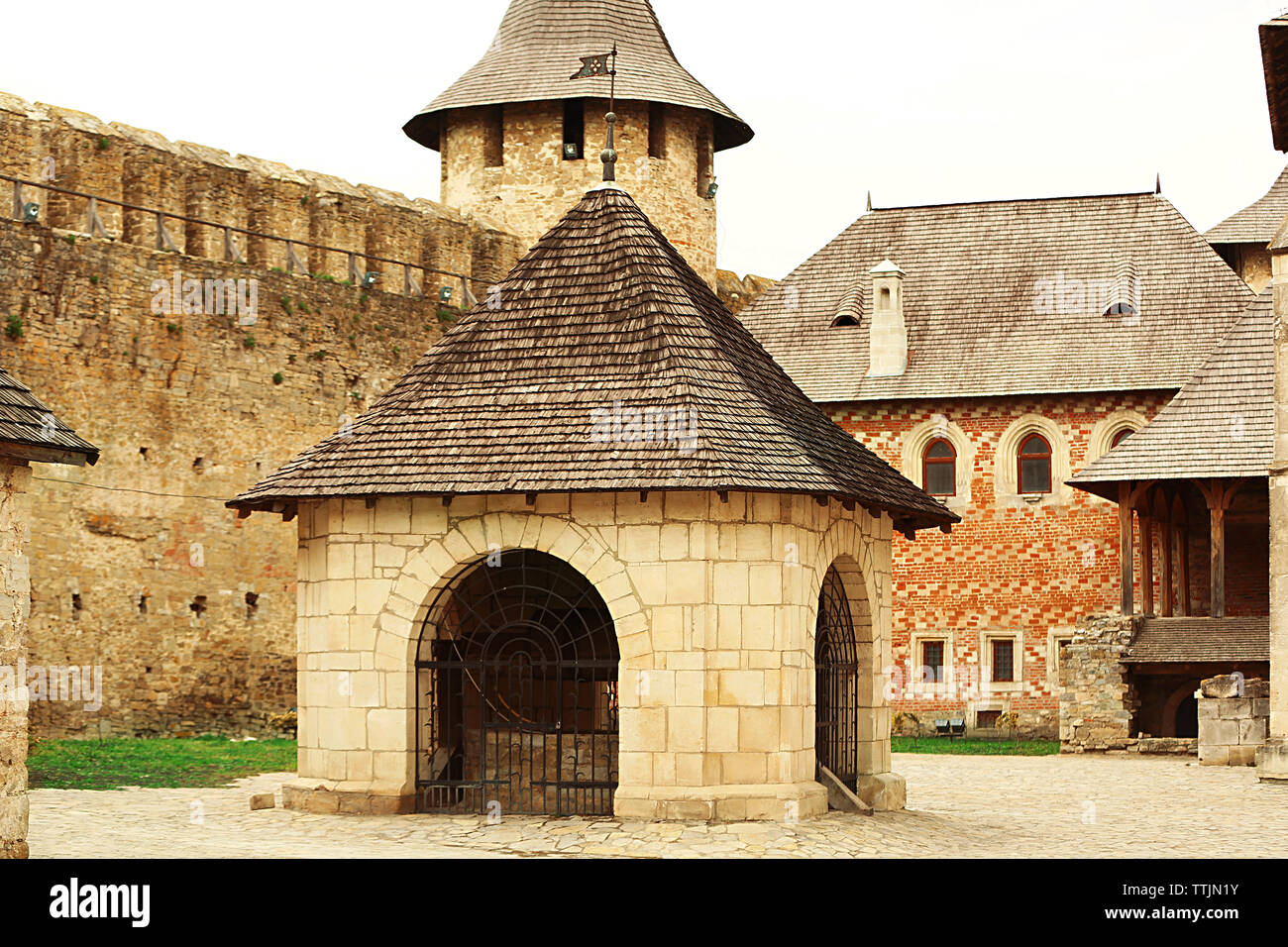 Medieval fortress in village Stock Photo - Alamy