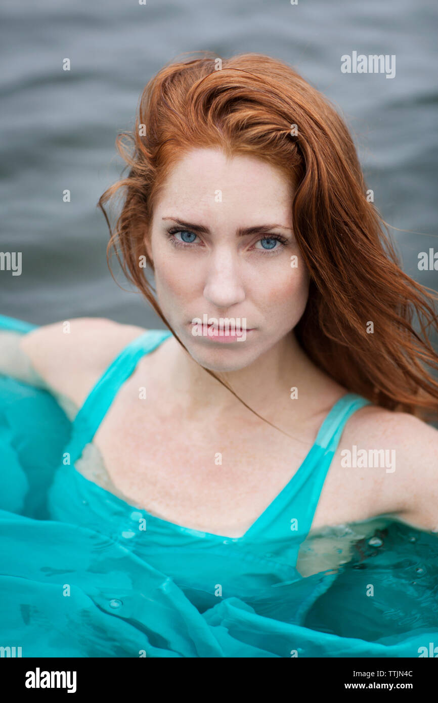 Portrait of woman swimming in sea Stock Photo - Alamy