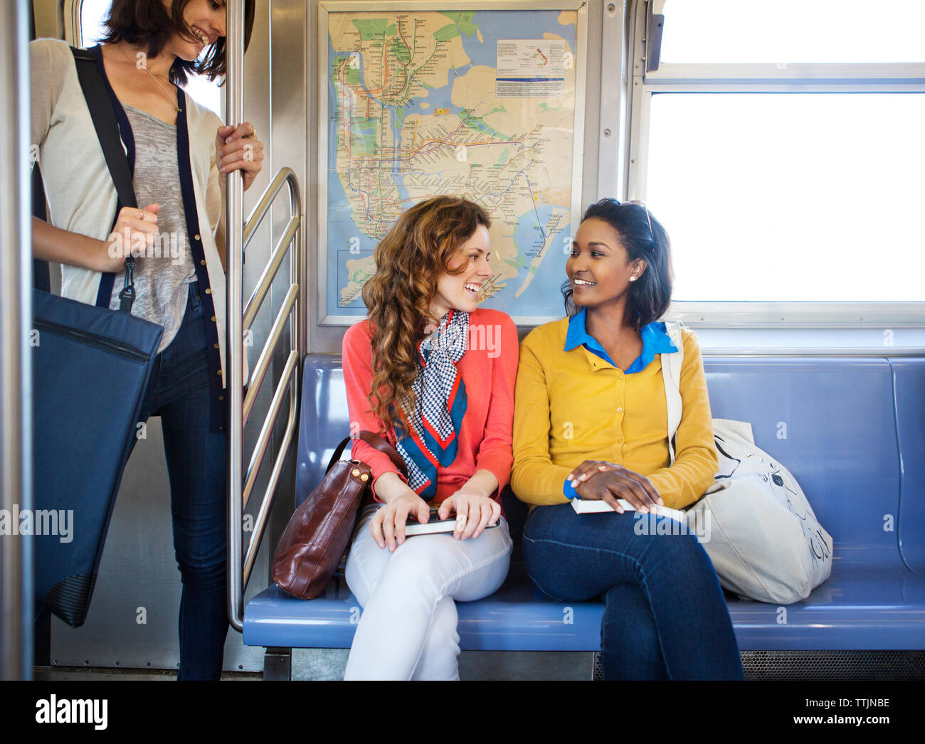 Train people traveling standing sitting hi-res stock photography and ...