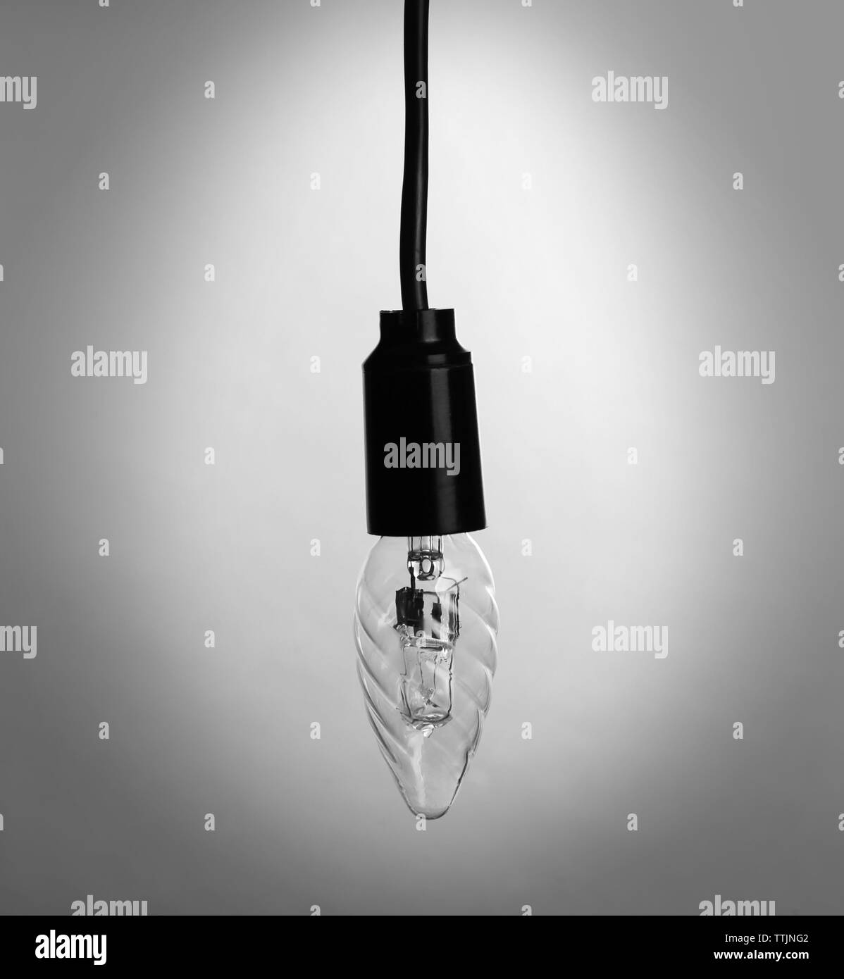 Light bulb on grey background Stock Photo - Alamy
