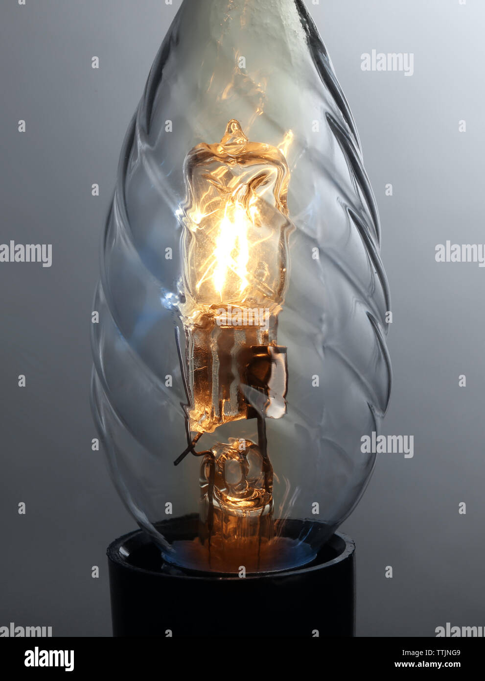 Light bulb on grey background Stock Photo - Alamy