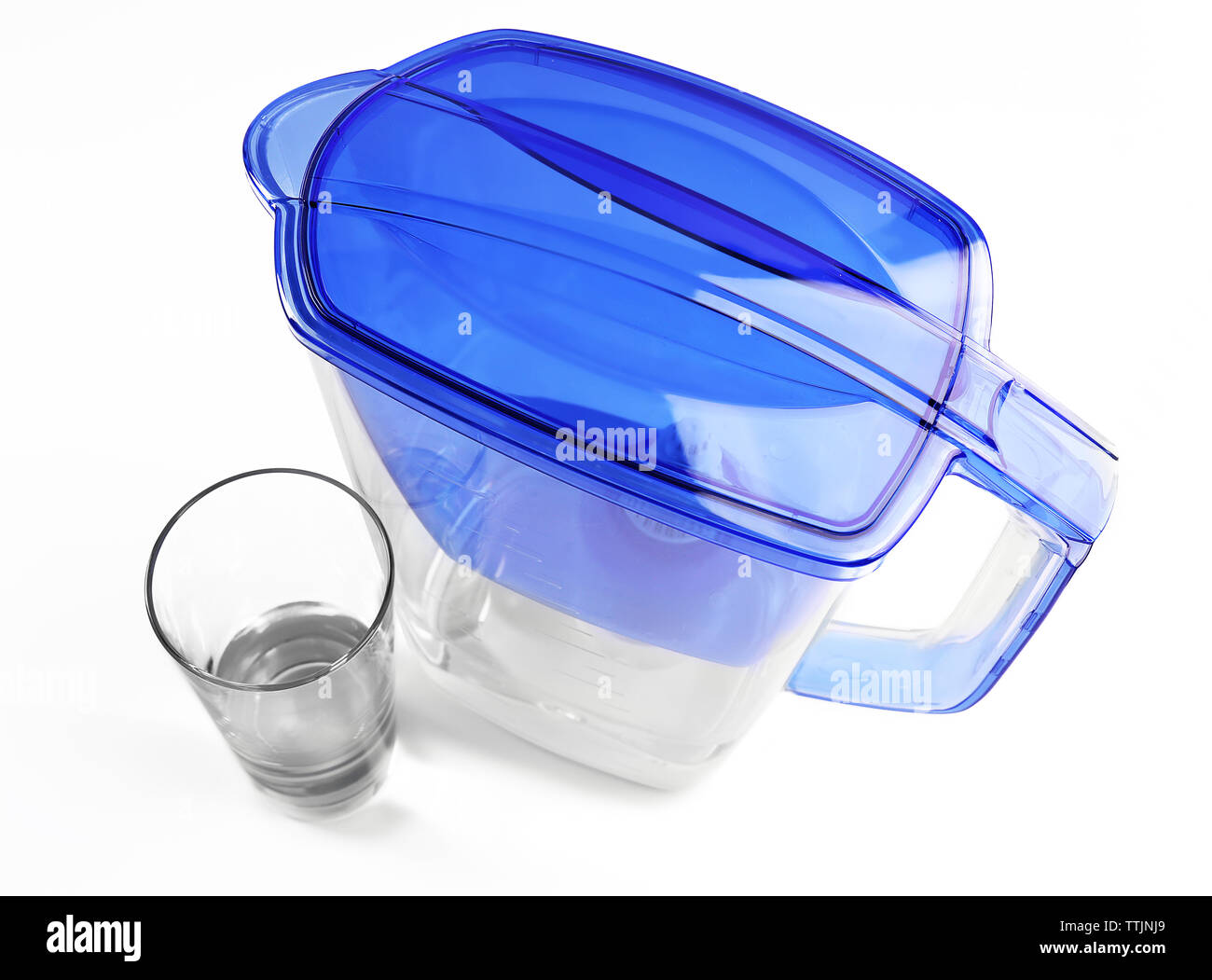 Blue water filter with glass on grey background Stock Photo - Alamy