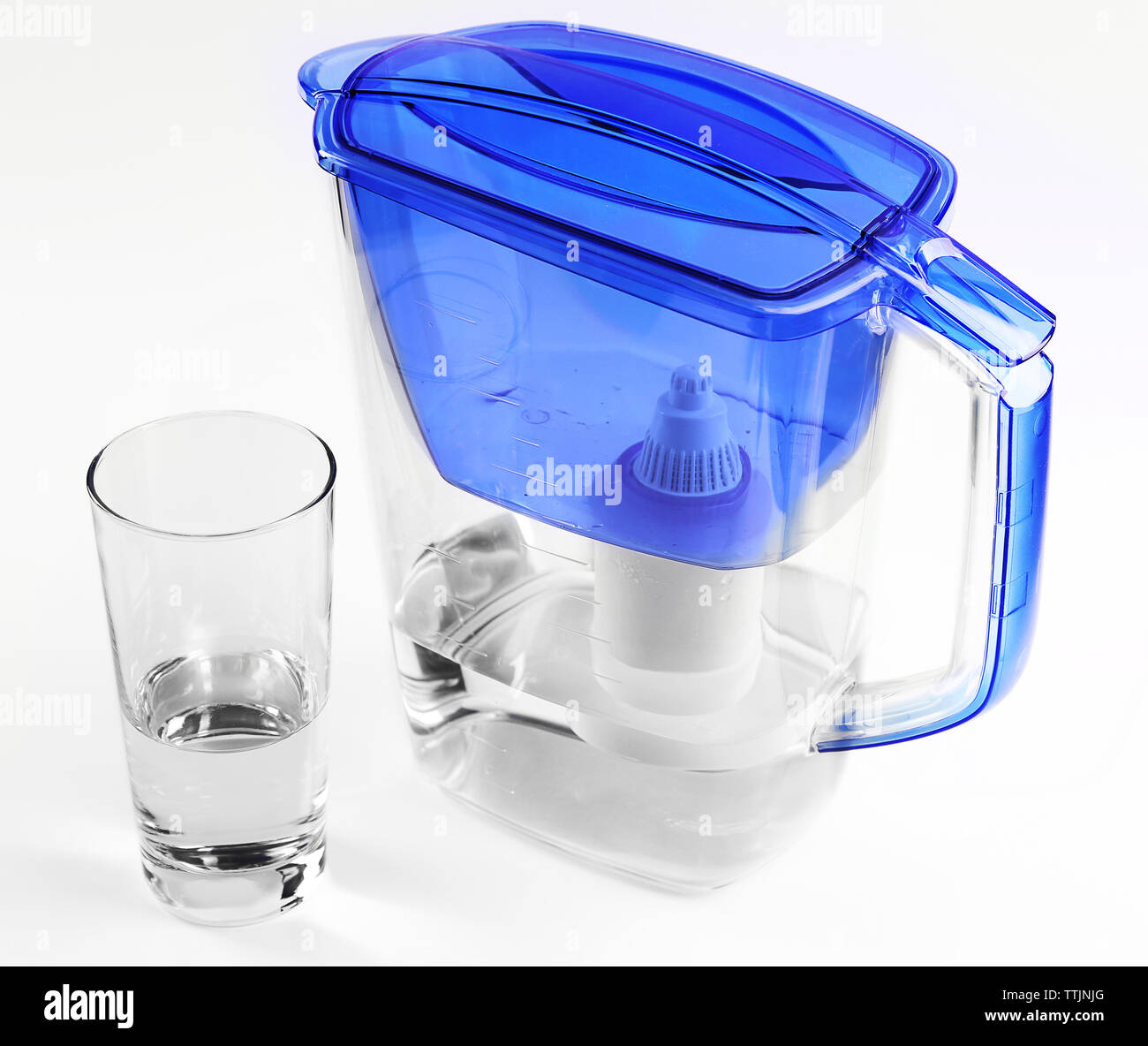 Blue water filter with glass on grey background Stock Photo - Alamy