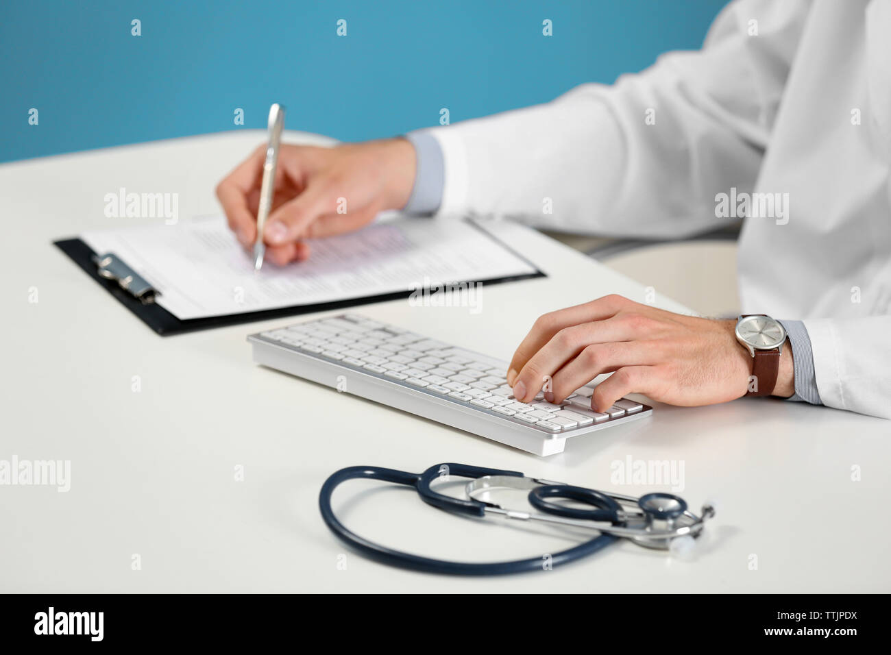 Doctor working on a computer in hospital Stock Photo - Alamy
