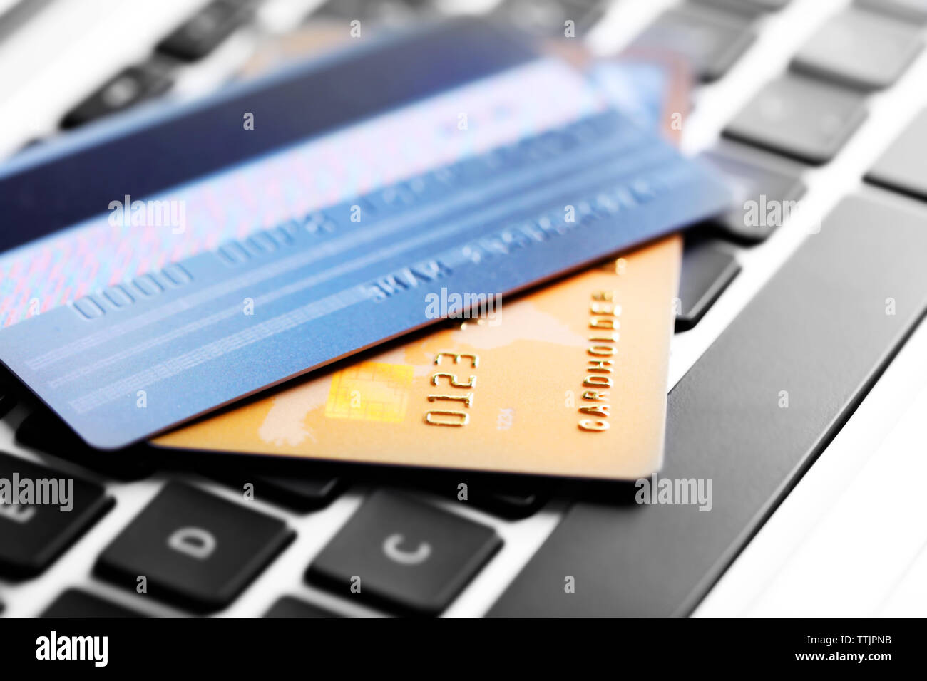 Credit cards on keyboard, closeup Stock Photo - Alamy