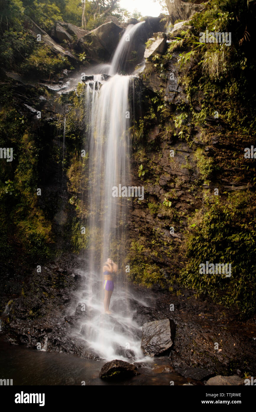 Woman under waterfall hi-res stock photography and images - Alamy
