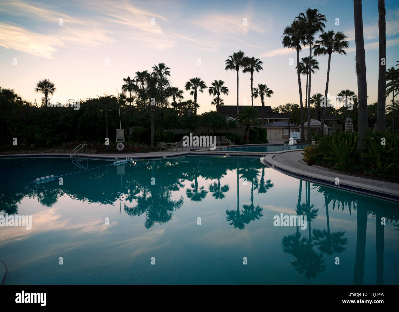 View of swimming pool at tourist resort Stock Photo - Alamy