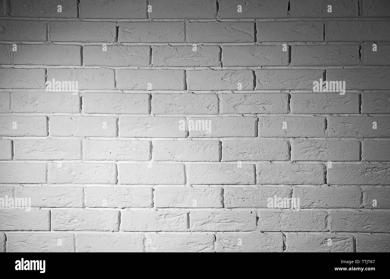 Grey brick wall background with shadow Stock Photo - Alamy