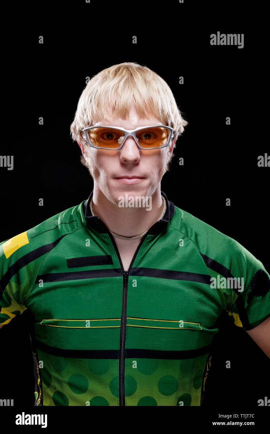 Portrait of man sportsperson standing against black background Stock ...