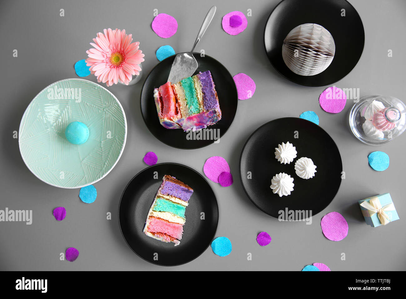 Colorful cake slices on gray background Stock Photo - Alamy