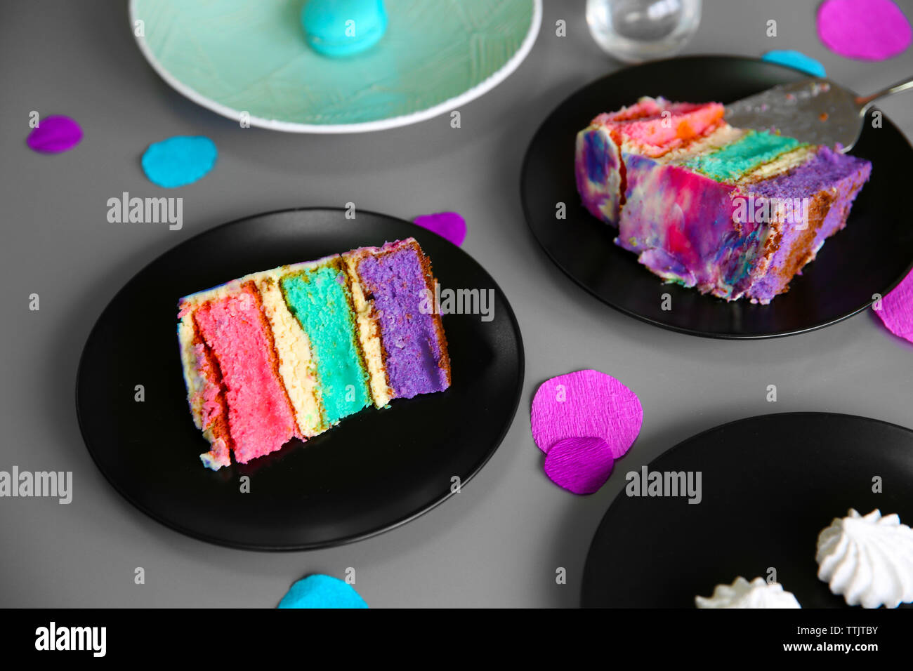 Colorful cake slices on gray background Stock Photo - Alamy