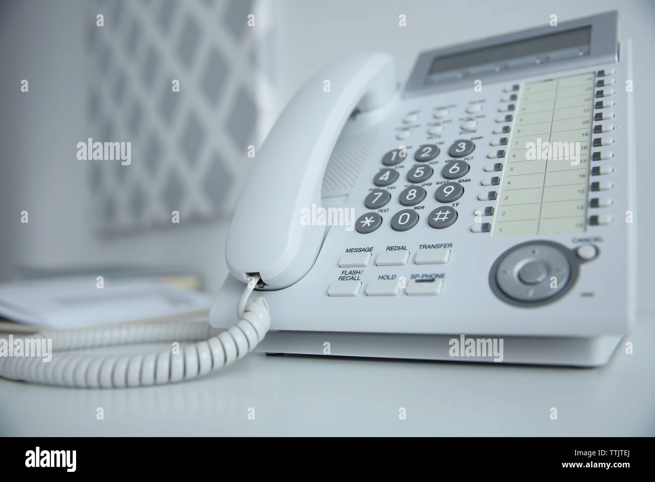 Office IP telephone on light background Stock Photo - Alamy