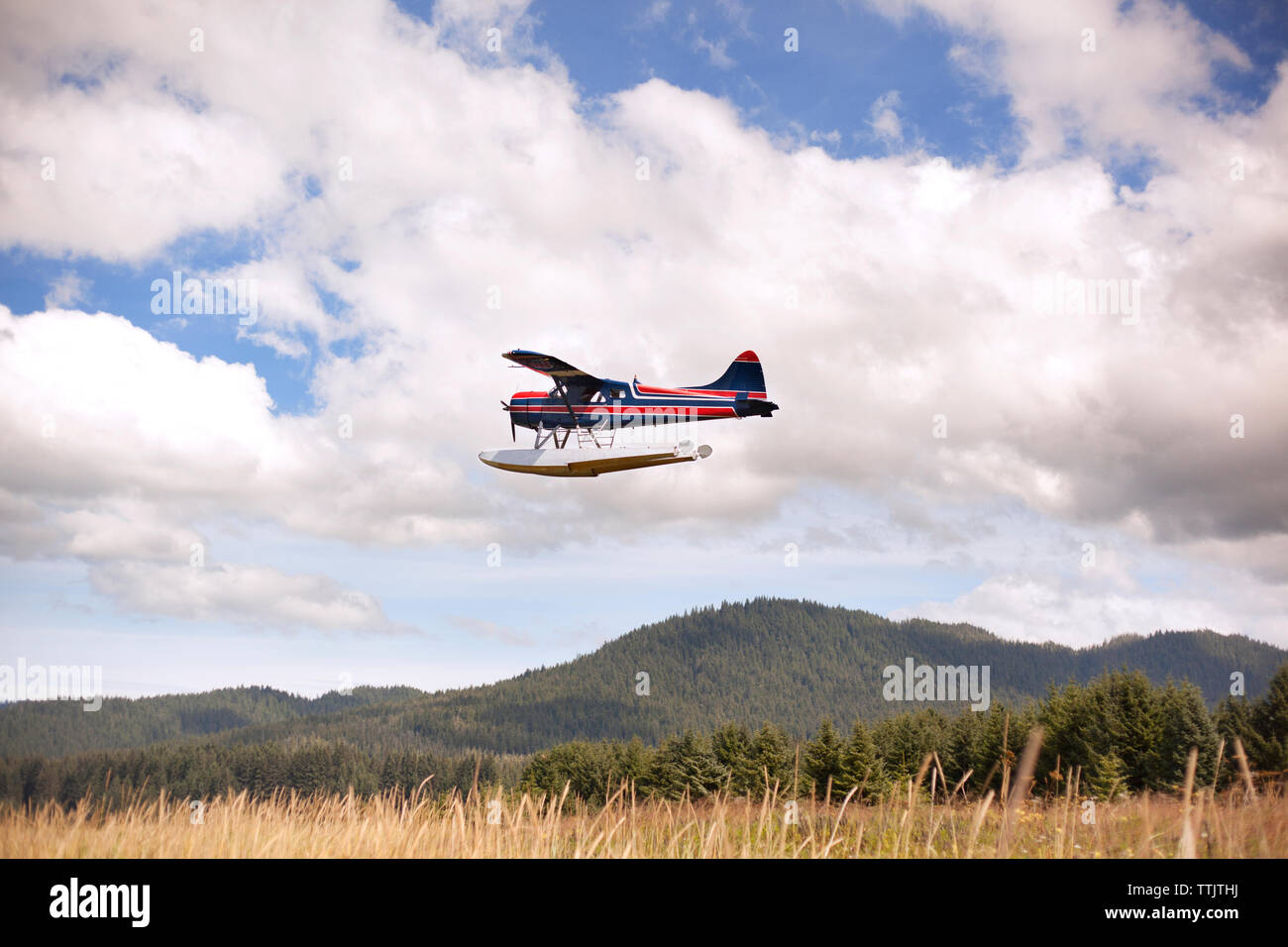 Seaplane flying over landscape Stock Photo - Alamy