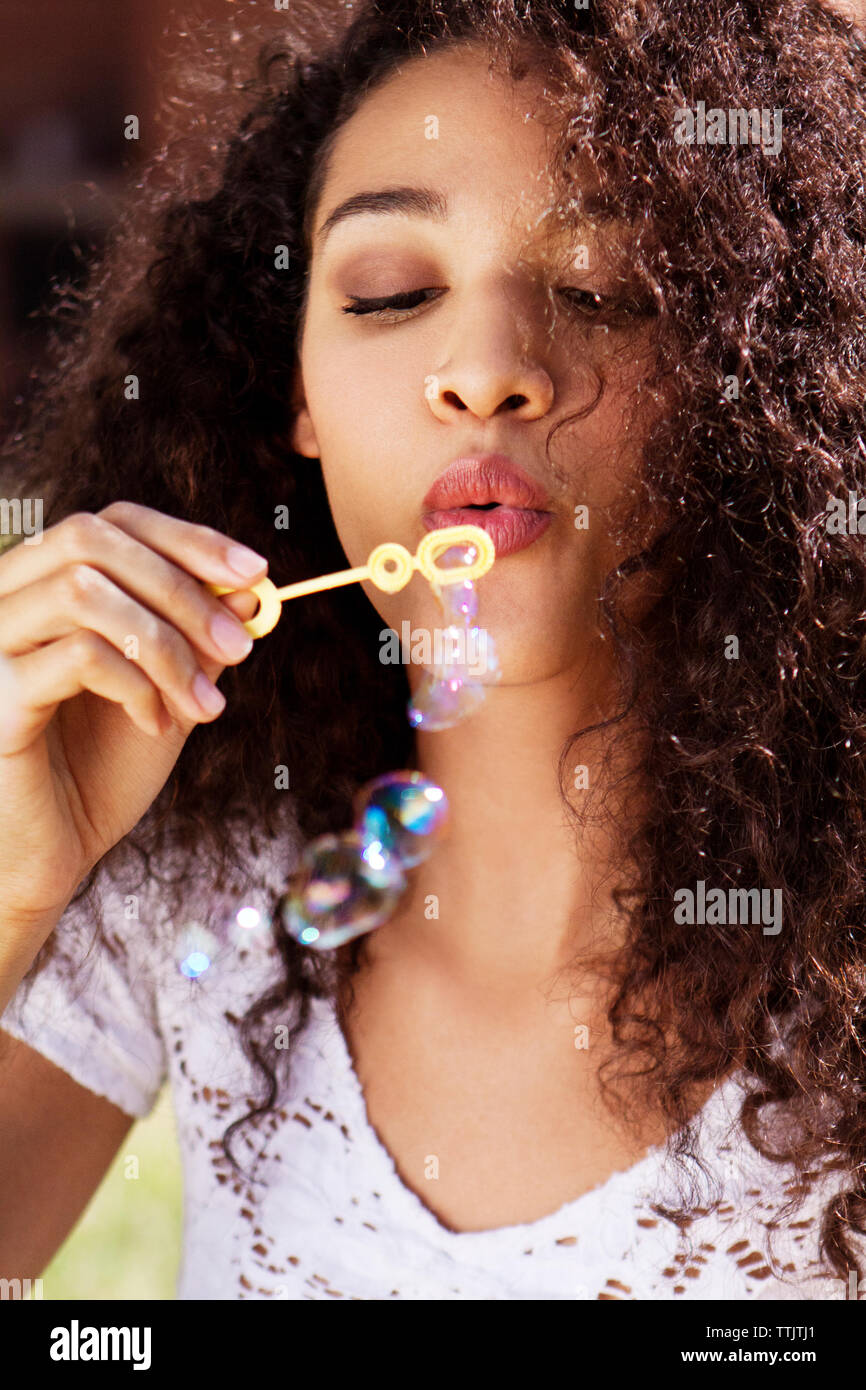 African woman blowing bubble hi-res stock photography and images - Alamy