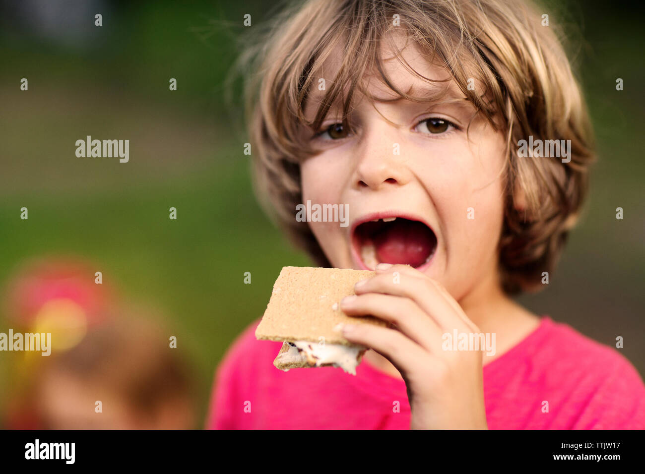 Boy eating smores hi-res stock photography and images - Alamy